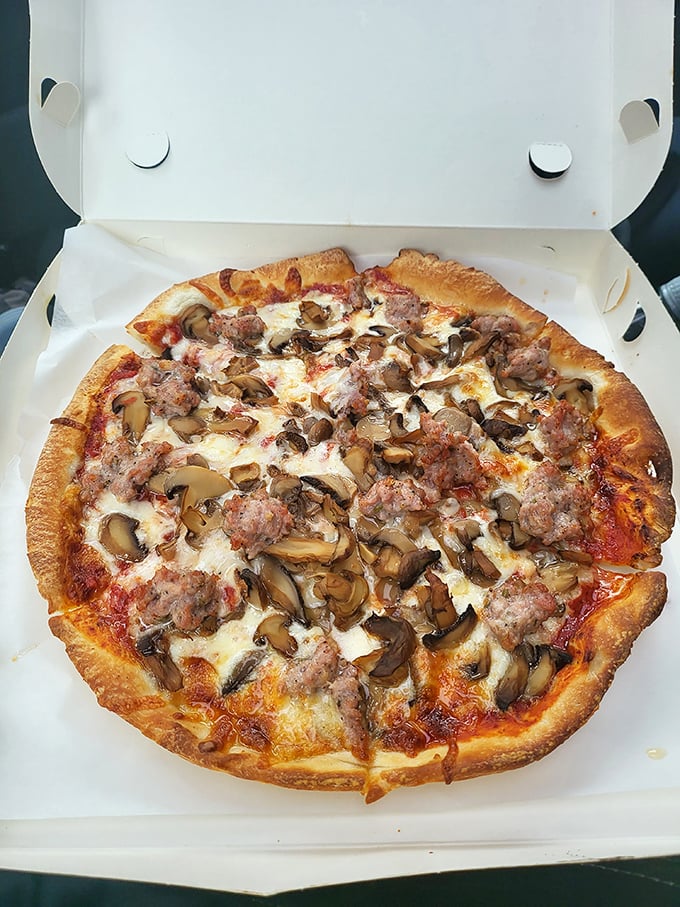 This mushroom and sausage pizza proves that fungi and pork are nature's perfect dance partners, especially when cheese is the chaperone.