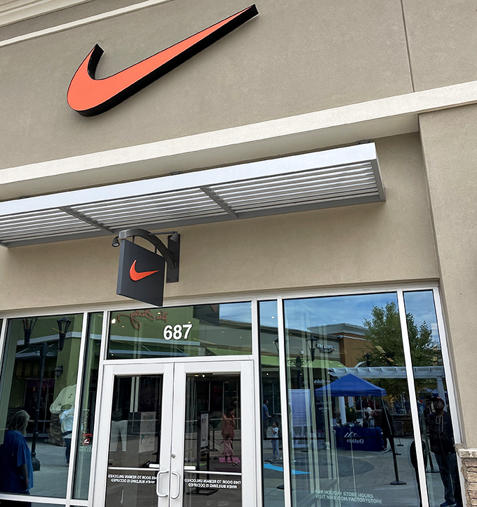 The iconic Nike swoosh—universal symbol for "just buy it" and the reason your closet has more athletic wear than actual athletic activity.