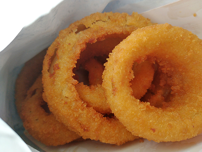 These onion rings form perfect golden circles of happiness, crispy outside and sweet inside like edible halos.