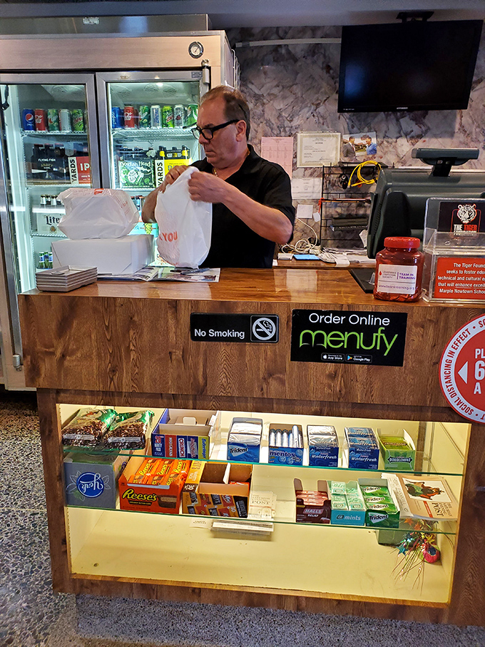 Where takeout dreams begin &ndash; the order counter stocked with candy temptations below and efficiency above, staffed by folks who know many customers by name.