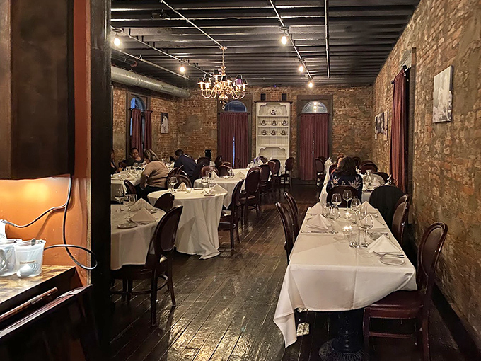 White tablecloths and exposed brick create the perfect backdrop for special occasions, where memories are made between courses.