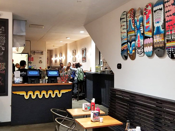 A space designed for sandwich worship. The counter's golden wave detail adds a touch of whimsy to this temple of taste.