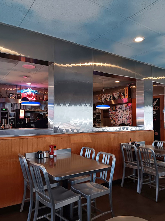 Metal chairs, wood paneling, and the soft glow of neon&mdash;not designed by an Instagram influencer, but authentically lived-in and loved.