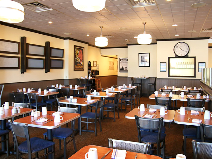 Empty tables that won't stay that way for long. The calm before the breakfast storm, where coffee mugs await their caffeinated destiny.