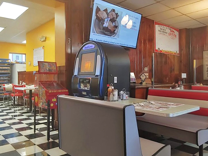 Another angle of diner perfection where wood paneling and vintage charm create timeless dining atmosphere.