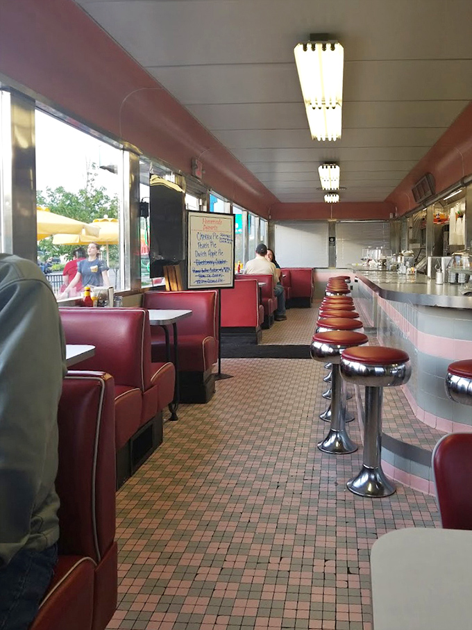 Classic diner layout with counter seating that invites conversation with strangers who might just become friends over pie.
