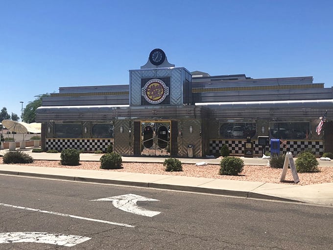 The classic diner silhouette stands proudly against the Arizona sky, a chrome-and-neon promise of comfort food that never disappoints.