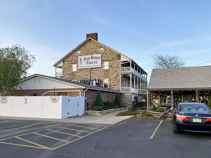 The tavern commands attention from its hillside perch, with parking spaces that feel like front-row tickets to a historical performance.