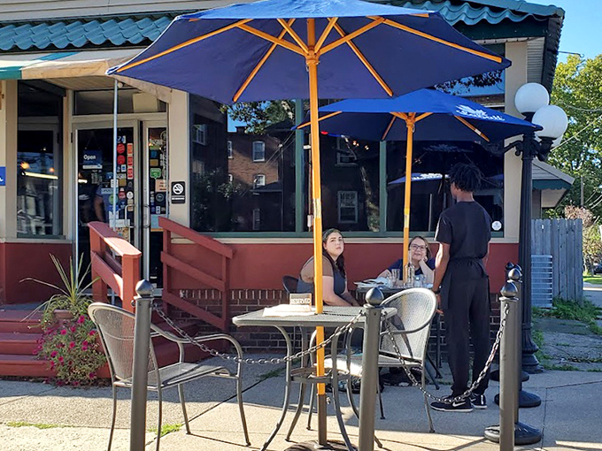 Outdoor dining under blue umbrellas &ndash; because sometimes Southern comfort food tastes even better with a side of fresh Pennsylvania air.