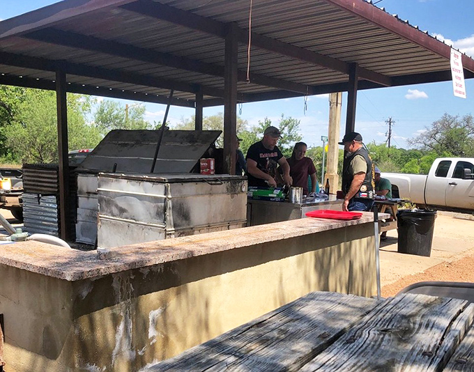 The outdoor grill station &ndash; where smoke signals of deliciousness rise from a setup that's not fancy but gets the job done spectacularly.