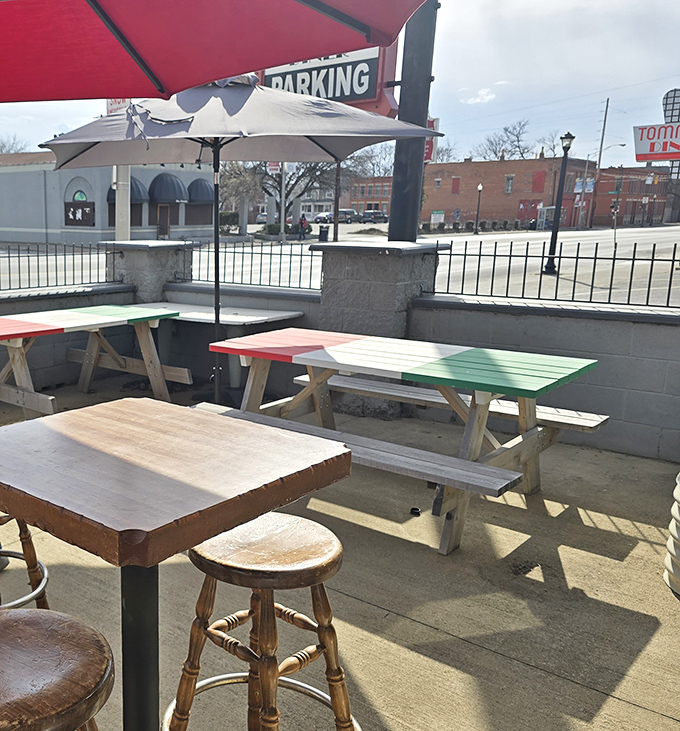The patio where pizza memories are made. Those picnic tables have heard more Columbus stories than any local historian.