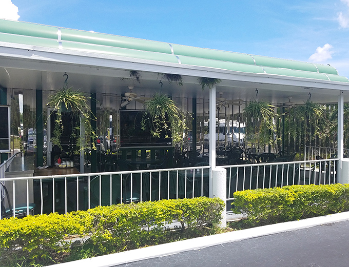 The covered porch seating area offers a Florida twist on diner culture&mdash;all the classic food with a side of sunshine and swaying plants.
