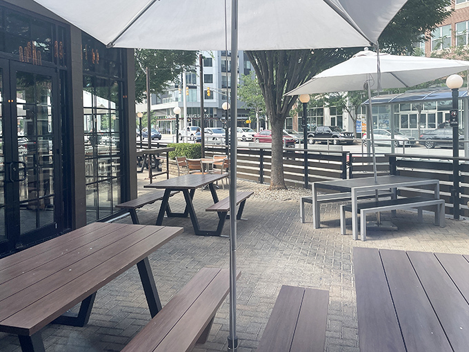 Outdoor seating at The Eagle offers the perfect perch for people-watching on bustling Mass Ave while savoring crispy, honey-drizzled chicken.