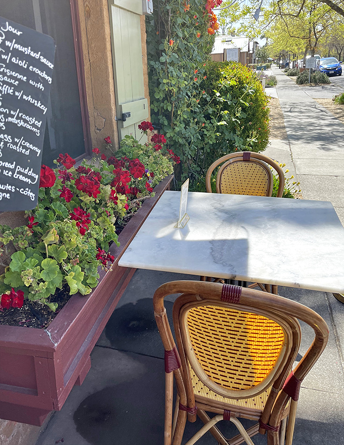 Sidewalk seating framed by blooming geraniums offers that quintessential French experience &ndash; people-watching with excellent food and Yountville's perfect weather as companions.