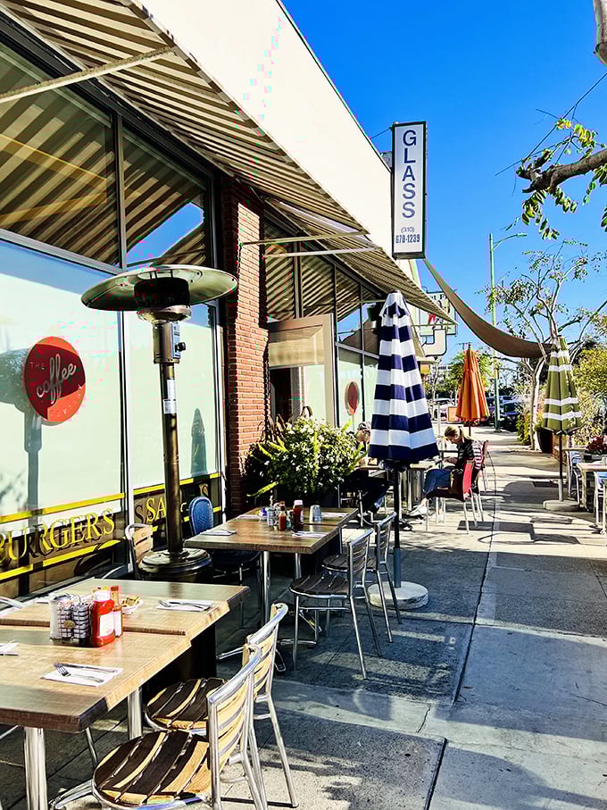 Sidewalk seating that captures LA's perfect weather advantage. Blue umbrellas, sunshine, and breakfast&mdash;some combinations simply can't be improved upon.