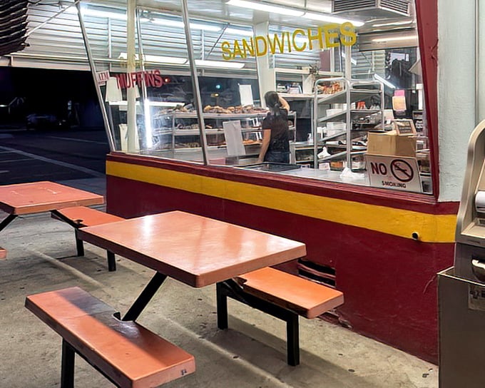 The outdoor seating area&mdash;simple, utilitarian, and perfect for that moment when you just can't wait to get home before biting into your prize.