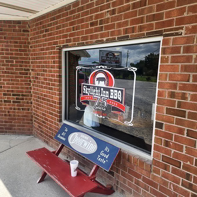 That window sign says "75 years" of barbecue excellence. Some marriages don't last that long, but this relationship with pork endures.