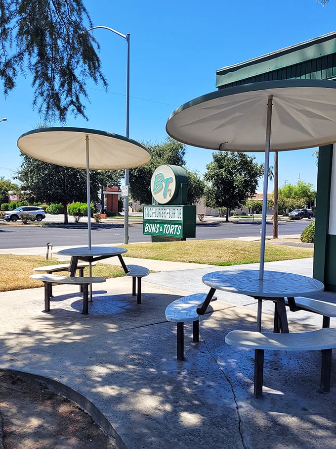 Outdoor seating with umbrellas offering shade for those who prefer their taco salads with a side of California sunshine.