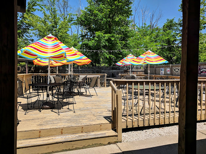 Summer perfection on the patio. Those rainbow umbrellas promise shade, but the food brings the sunshine.