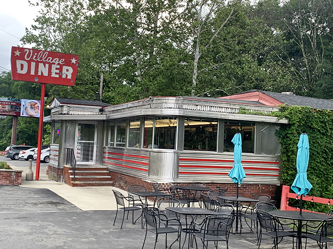 The diner's exterior view shows off its classic lines and vintage charm. Like stepping into a Norman Rockwell painting with better food.