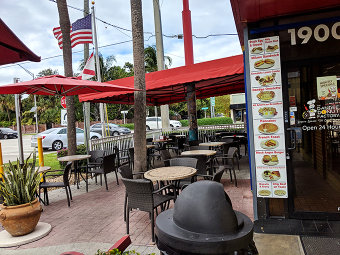 The outdoor seating area &ndash; where donut enthusiasts gather under Florida skies to contemplate life's sweetest mysteries.