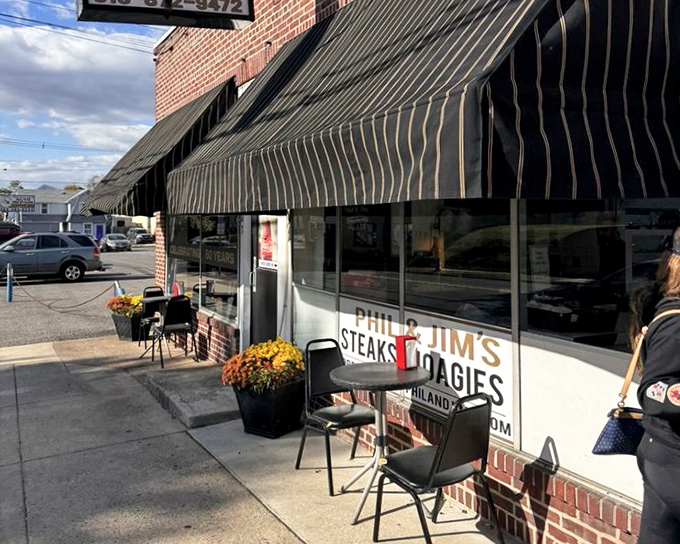 Seasonal decorations welcome hungry pilgrims to this sandwich shrine. Those mums aren't just pretty&mdash;they're saying "good food inside."