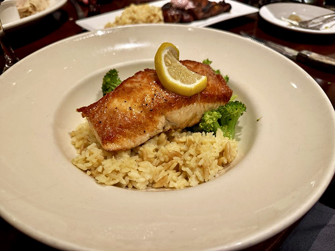 Pan-seared salmon perched on a throne of rice with a lemon crown &ndash; simple, elegant, and proof that Vic Stewart's excels beyond just beef.