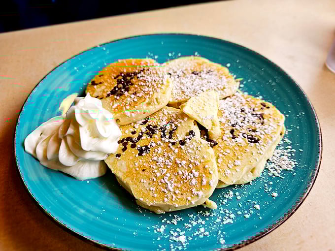 Silver dollar pancakes dusted with powdered sugar&mdash;little clouds of joy that prove sometimes the best things come in small, perfectly golden packages.