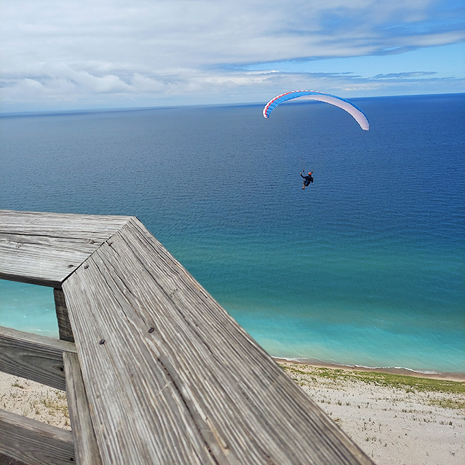 Paragliding past the dunes—the scenic route for those who prefer their breathtaking views without the breathless climbing.