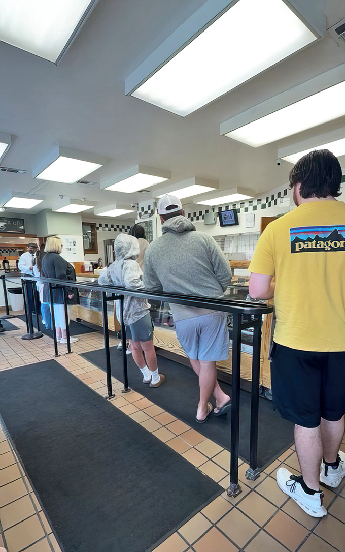 The pilgrimage line&mdash;where patience is tested but always rewarded. Notice the diverse crowd united by a common quest for fried perfection.