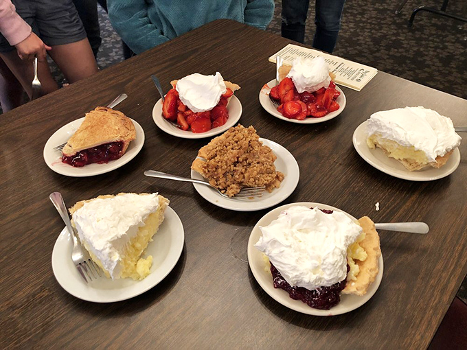 The dessert table - where diet plans go to die gloriously. Seven different paths to happiness, all involving whipped cream.