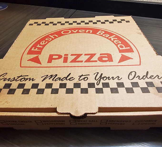 "Custom Made To Your Order"&mdash;the pizza box promises what every great neighborhood joint delivers: food made for you, not for Instagram.
