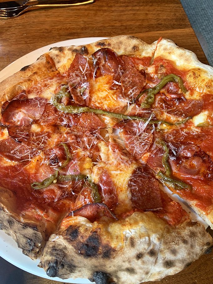 This isn't just pizza &ndash; it's a thin-crust canvas where pepperoni, green peppers and cheese create a symphony of flavors that sings.