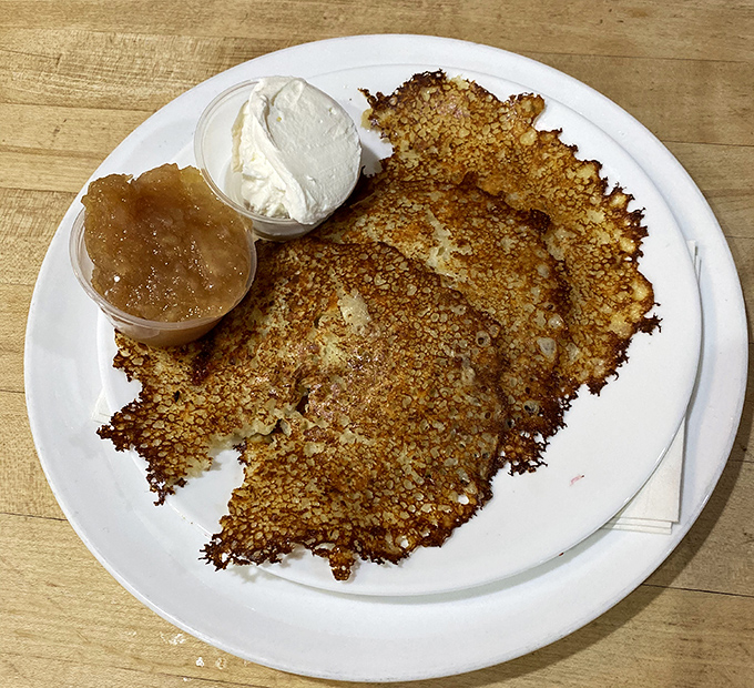 Potato pancakes with the perfect crispy edges that make you wonder why you ever bothered with the regular kind. Served with applesauce and sour cream.