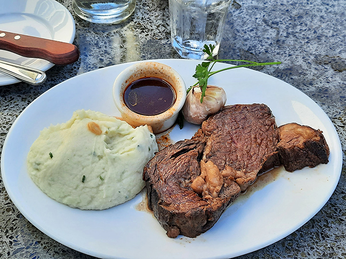 This prime rib isn't just dinner; it's a primal satisfaction that connects you to every carnivore who's ever lived, plus garlic mashed potatoes.