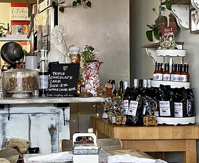 Homemade treats and coffee line the shelves like treasures in a culinary museum. That ceramic rooster stands guard over deliciousness.