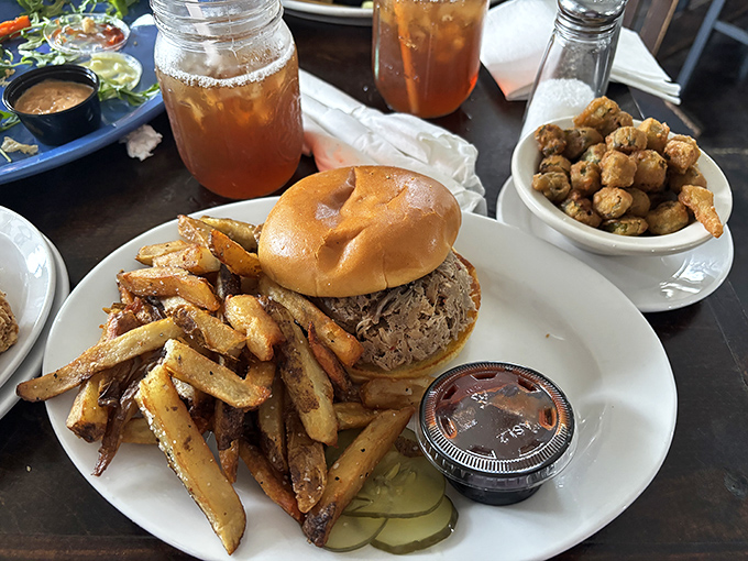 Bennett's BBQ sandwich doesn't need fancy presentation&mdash;just plenty of napkins. Tender pulled pork on a soft bun with crispy fries is Southern poetry on a plate.
