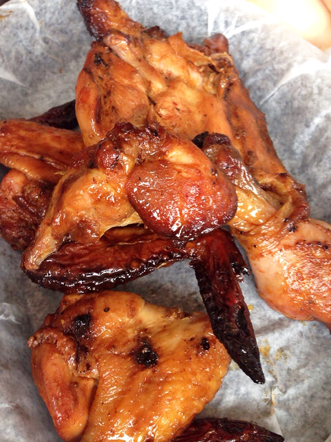 These chicken wings have clearly signed a non-disclosure agreement with the smoker, revealing just enough of their flavor secrets to keep you coming back.