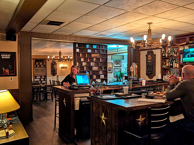 The host station doubles as command central, where the dining room ballet is orchestrated amid star-studded decor.