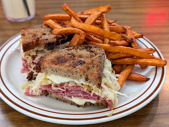 A proper Reuben sandwich with sweet potato fries that proves lunch can be just as exciting as breakfast at this all-day diner paradise.