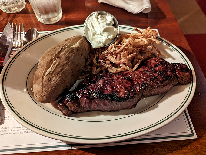 A steak dinner with all the fixings&mdash;where the potato comes dressed for the occasion and the onion strings add a crispy crown.