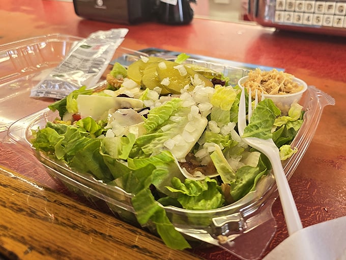 Even the salad gets the respect it deserves&mdash;crisp lettuce, fresh toppings, and what appears to be a side of that famous turkey, because vegetables need friends too.
