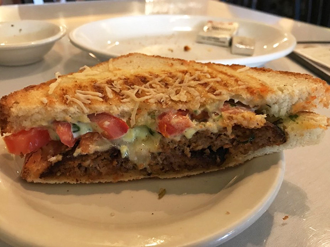 Not just a sandwich but an architectural marvel&mdash;layers of savory filling and melted cheese creating the perfect handheld masterpiece.