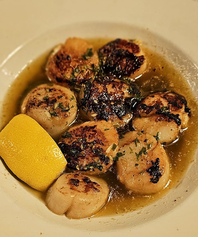 These scallops aren't just seared&mdash;they're transformed into buttery medallions of oceanic perfection, swimming in a sauce you'll want to bottle and take home.
