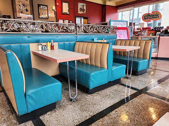 Turquoise booths pop against cream-colored seats in a color scheme that whispers "1950s optimism" while inviting modern-day comfort-seekers to relax.