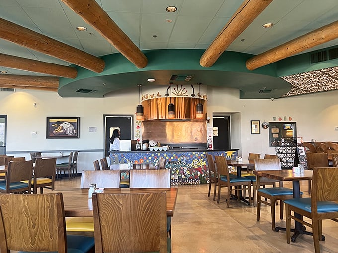 Wooden beams meet turquoise accents in a dining room that feels both rustic and refined. The Southwest's answer to Scandinavian design sensibility.