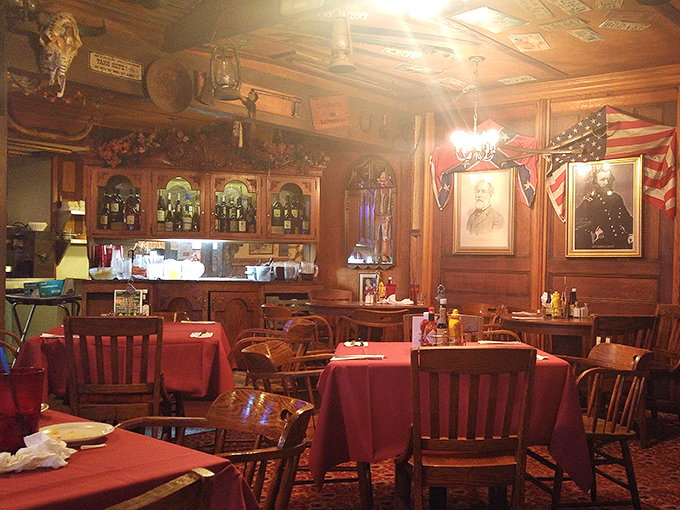 The dining room balances rustic charm with unexpected elegance&mdash;red tablecloths under wooden beams where history and hunger meet.