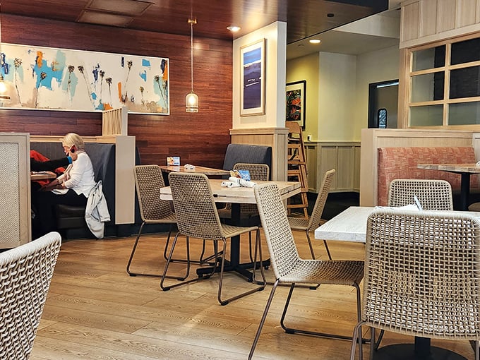 Woven chairs and warm wood create the perfect backdrop for seafood stories. It's casual elegance that never tries too hard.