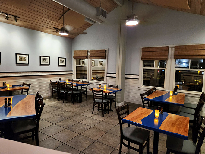Simple elegance defines Guppy's dining room, where wooden tables, comfortable chairs, and soft lighting create the perfect stage for seafood to take the spotlight.
