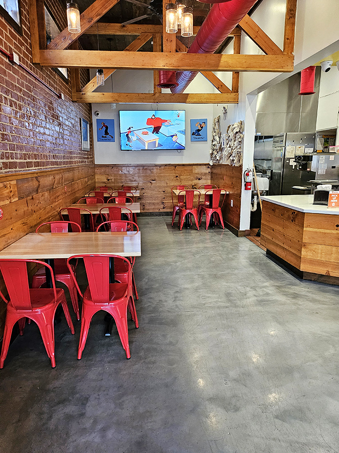 Red chairs against wooden walls create the perfect setting for the serious business of enjoying food that demands your full attention.